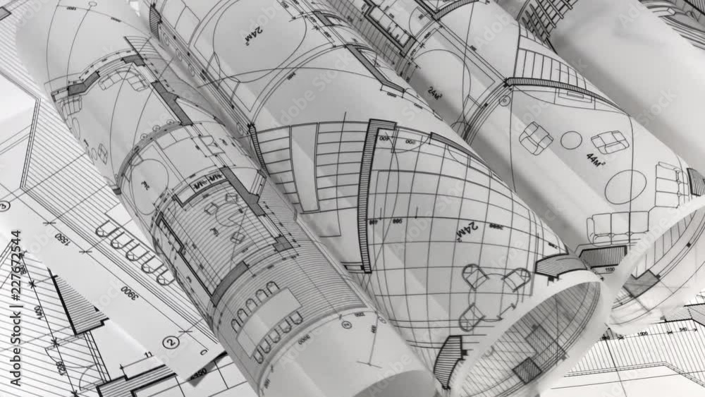 Blueprints - rolls of architectural drawings smoothly rotate on the ...