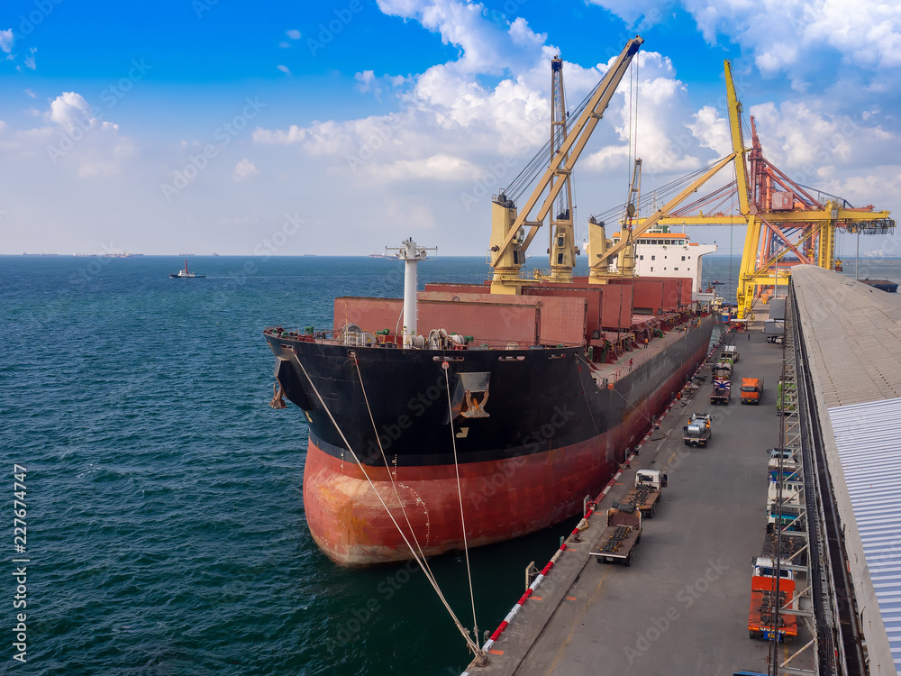 Vessel alongside at thailand port and discharging general cargo. Vessel ...