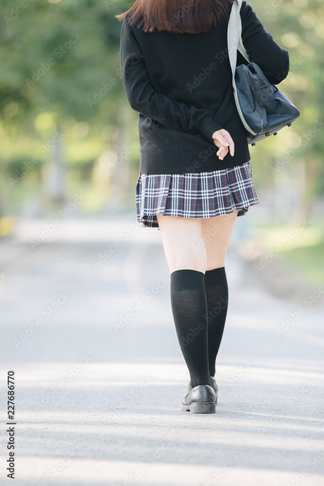 Portrait Of Asian Japanese School Girl Costume Walking At Park Outdoor Film Vintage Style Stock