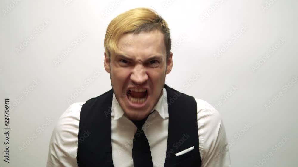 emotional portrait of a crazy guy in close-up. concept: the nervous ...
