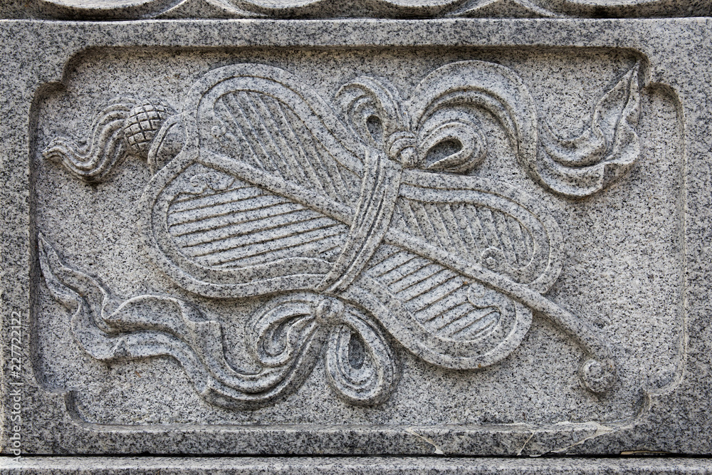 Stockfoto The object of the granite carving is a a palm-leaf fan ...
