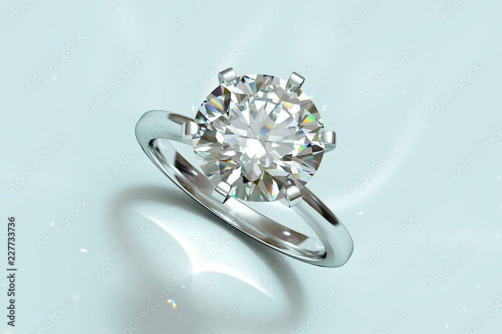 Round cut solitaire diamond engagement ring on light blue background ...