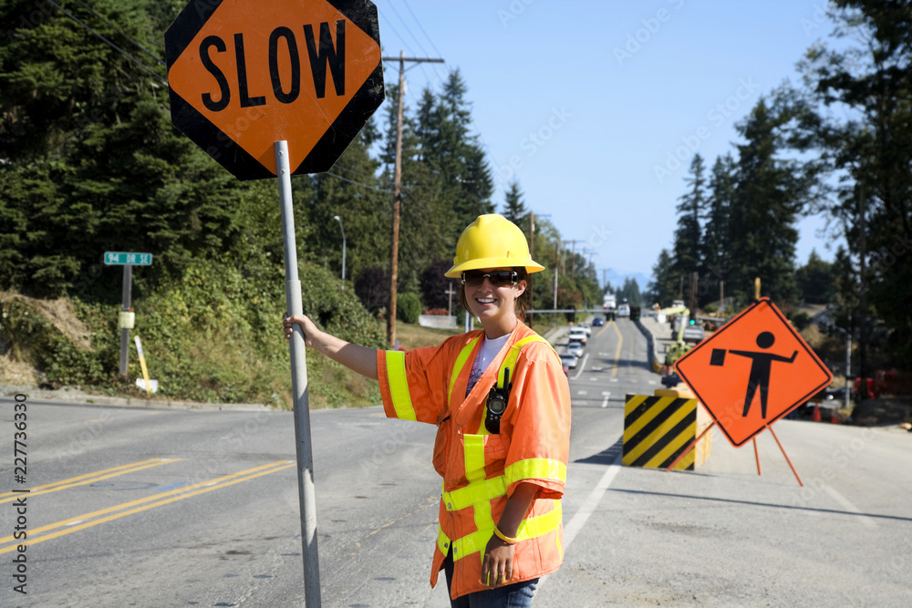 construction worker with stop sign on road Stock Photo | Adobe Stock