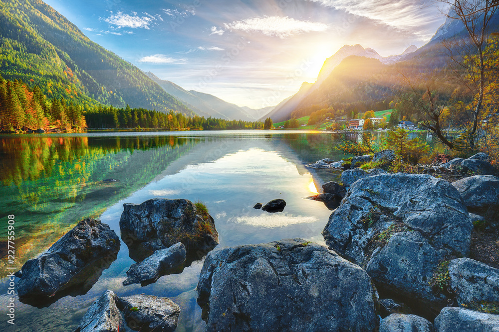 autumn sunset of Hintersee lake. Beautiful scene of trees near ...