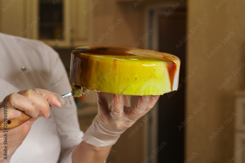 Mousse cake pear bri sherry. The girl creates a drawing of mousse on ...