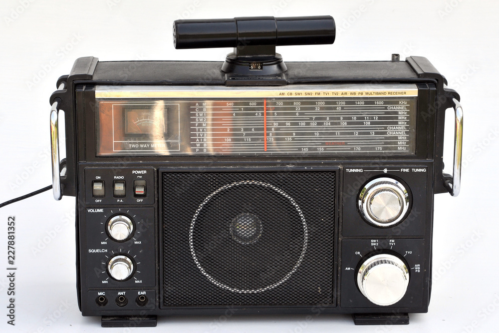 Old multiband radio receiver with an external transverse antenna on the ...
