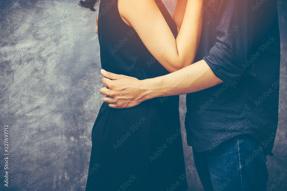 Concept of love relationship, with closeup on legs and shoes of a ...
