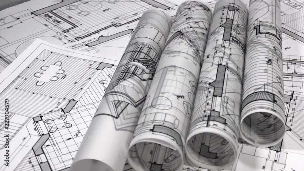 Blueprints - rolls of architectural drawings smoothly rotate on the ...