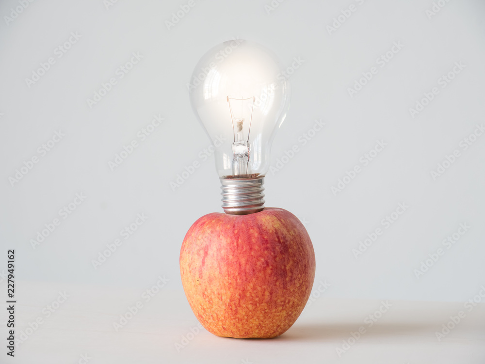 Light bulb in red apple on white background, Stock Photo | Adobe Stock