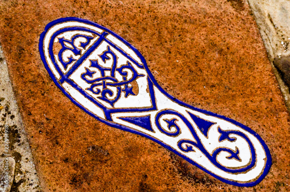ceramic tile with an element of reflection of the human foot, a ...