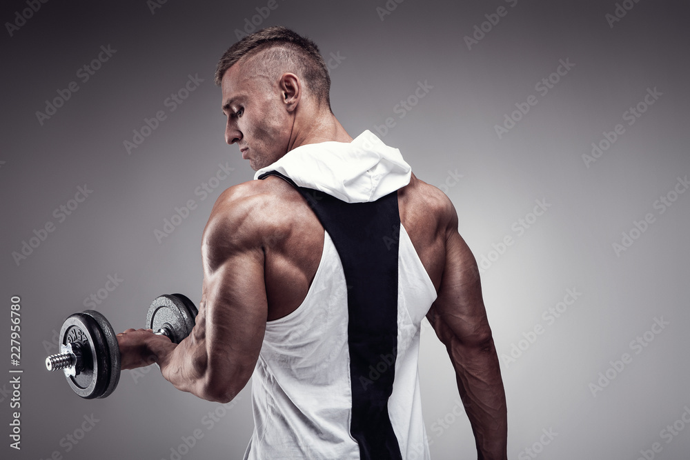 Fitness Model posing back muscles, triceps, latissimus Stock Photo ...