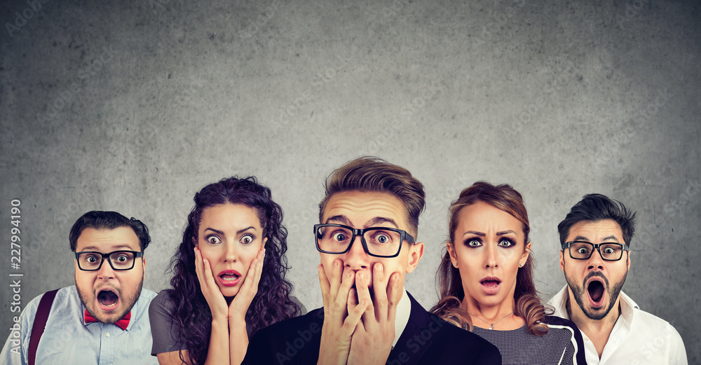 Shocked man in glasses and his scared friends Stock Photo | Adobe Stock