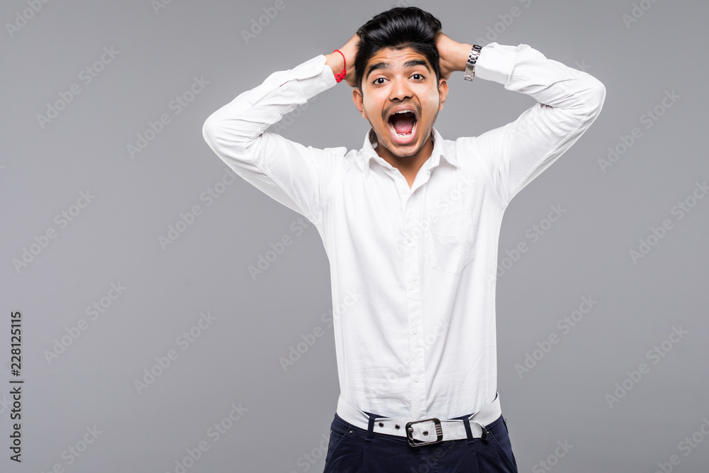 Astonished expressive young man with open mouth holding hand on cheek ...