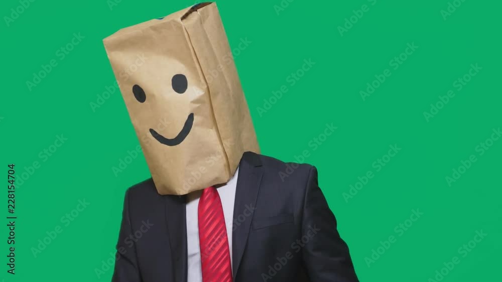 concept of emotions, gestures. a man with paper bags on his head, with ...