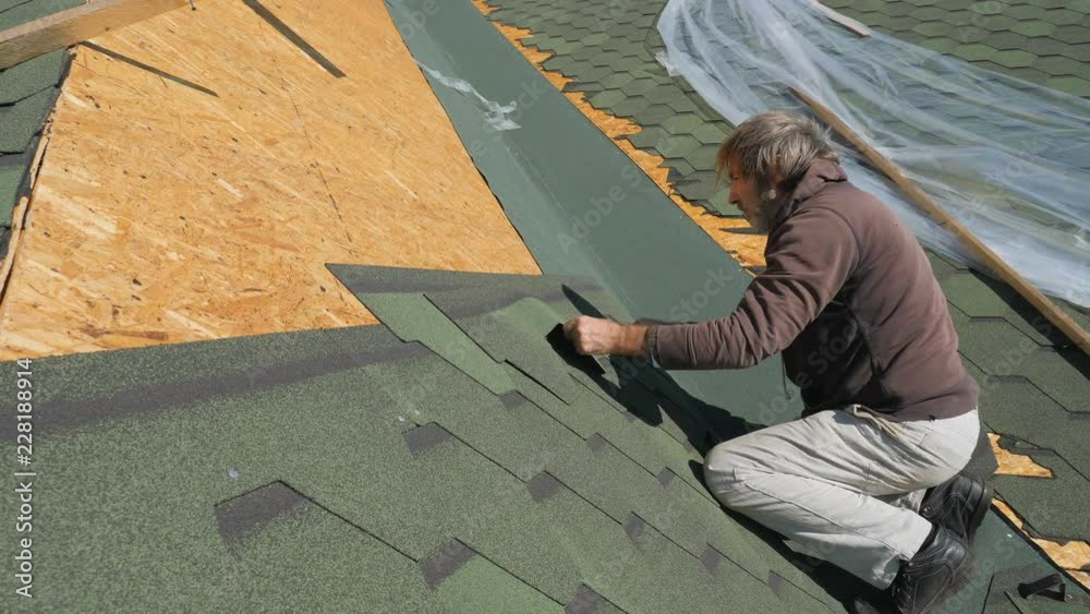 Video Stock soft roof of shingles. Repair of the roof of a residential ...