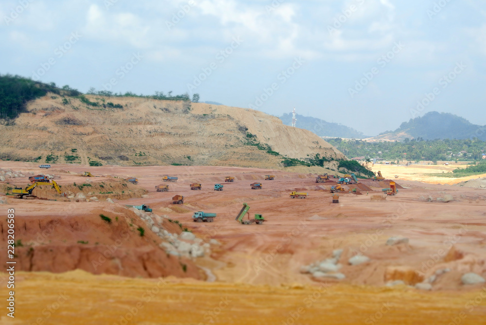 Earthworks at the construction site by construction heavy machine to ...