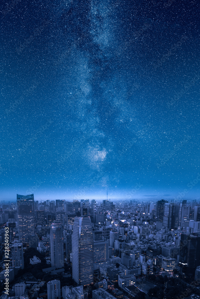 Stars of the milky way over big city skyline at night Stock Photo ...