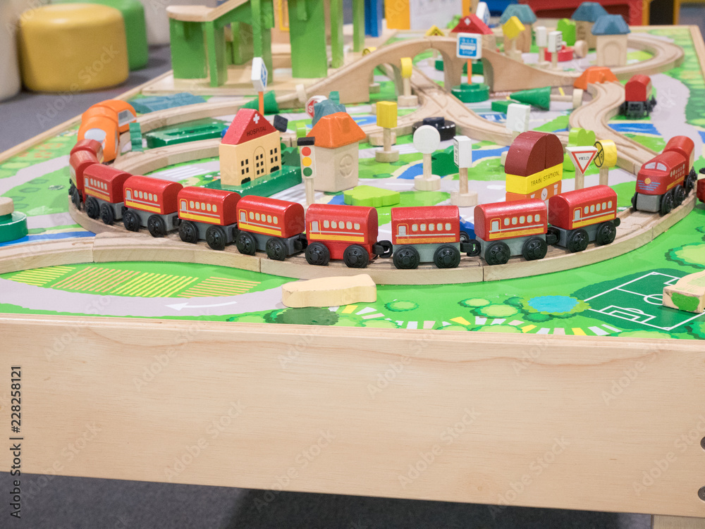 44 Wooden toy red train on rail road going round a bend with bridge in ...
