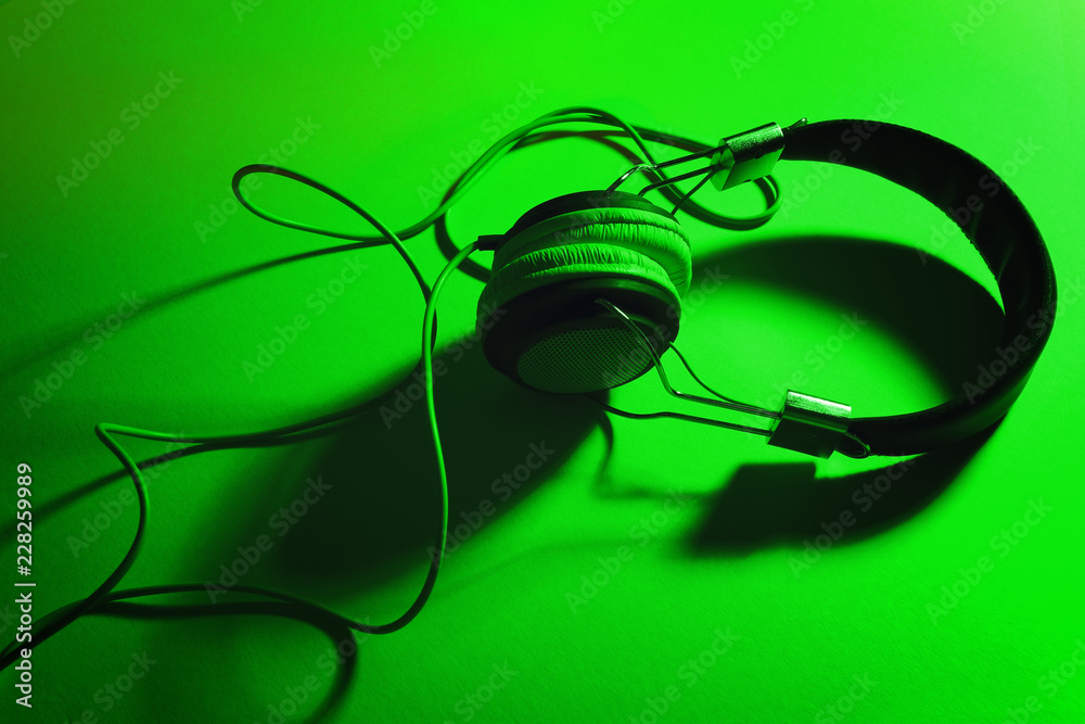 Modern headphones on bright color background Stock Photo | Adobe Stock