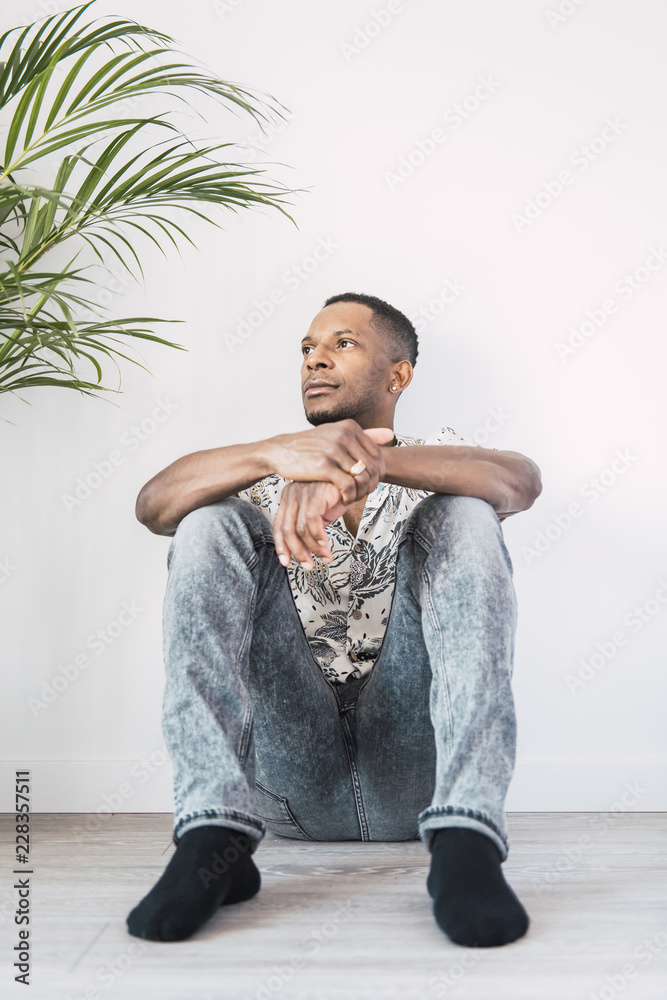 Person Sitting On Ground Facing Away