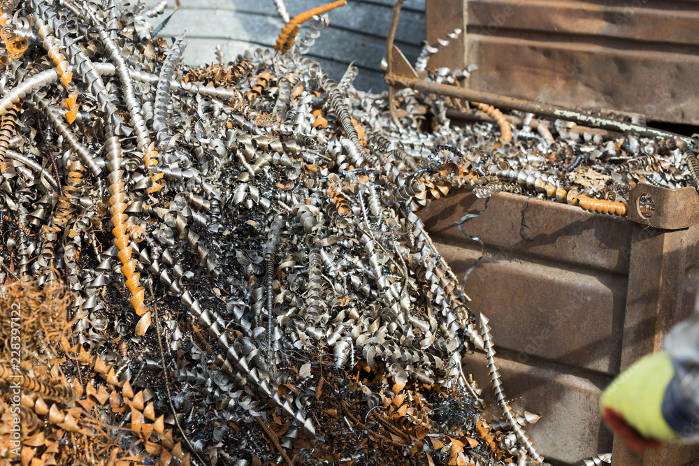 silver spirals of metal shavings as garbage, texture of different size ...