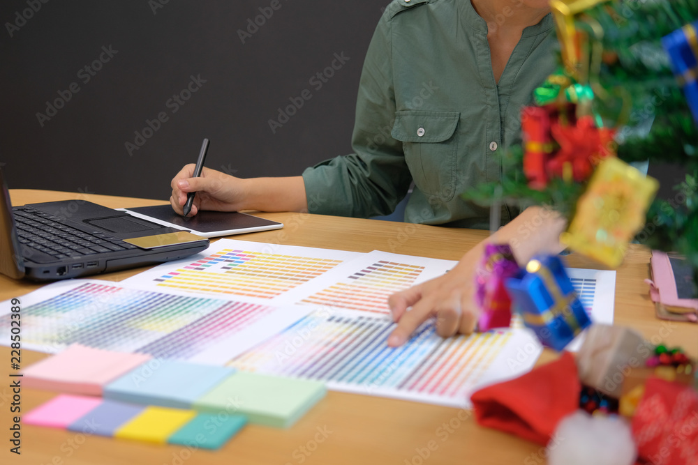 graphic interior designer choosing color from swatch sample. creative ...