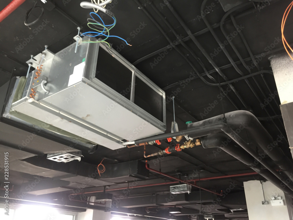 Installation of Air handing unit or Fan coil unit in loft office Stock ...