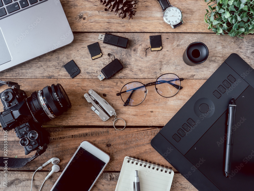 top view office table concept with coffee cup, digital camera, notebook ...