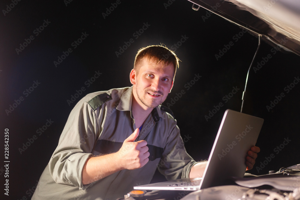 The mechanic in uniform shows that the engine is all right. Raised ...