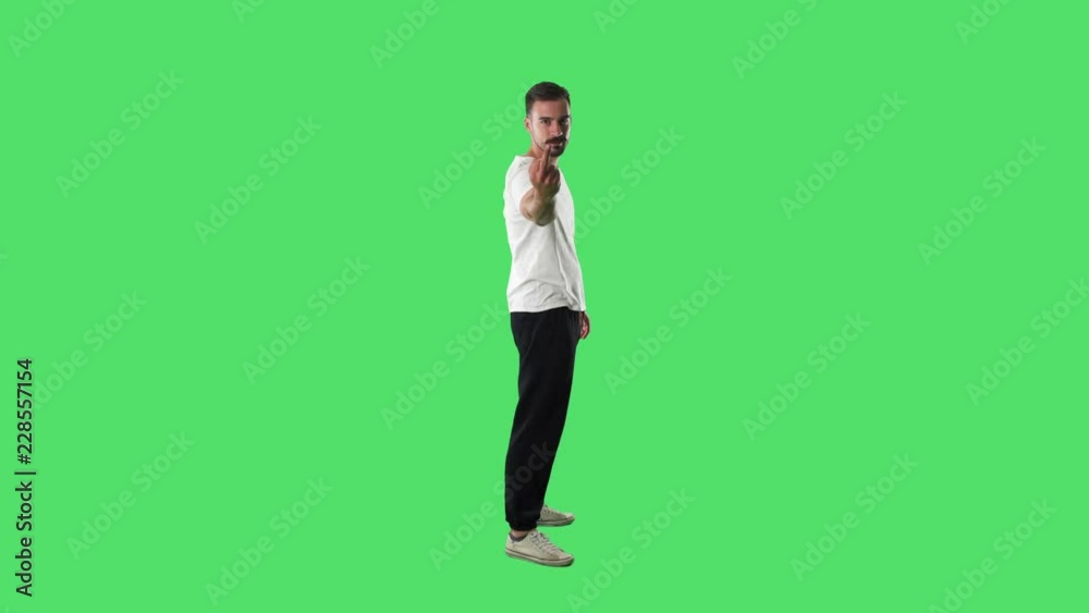 Rear view of young rude man turning to camera and showing obscene ...