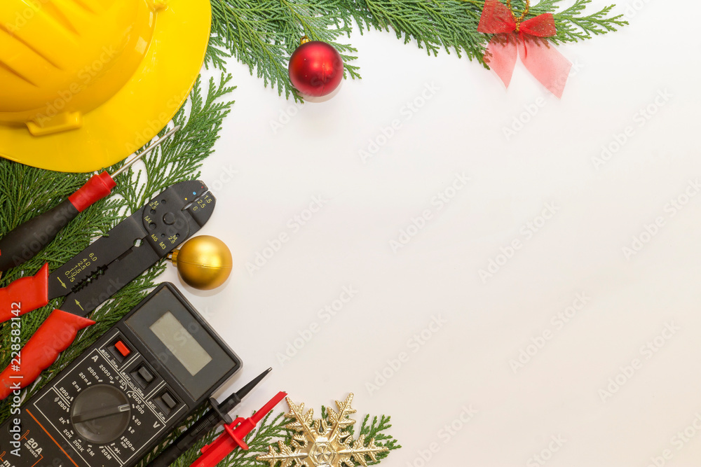 Electrician tools and instruments and Christmas decorations on white ...