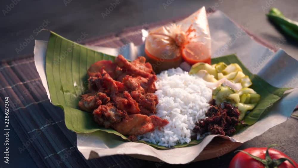 nasi kukus, traditional malay steamed rice with tumeric fried chickens ...