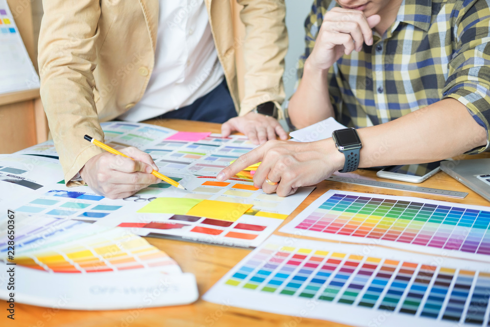 Creative Graphic designer at work. Color swatch samples pantone palette ...