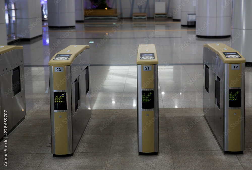 Ticket barriers at subway entrance, transpotation symbols of developed ...