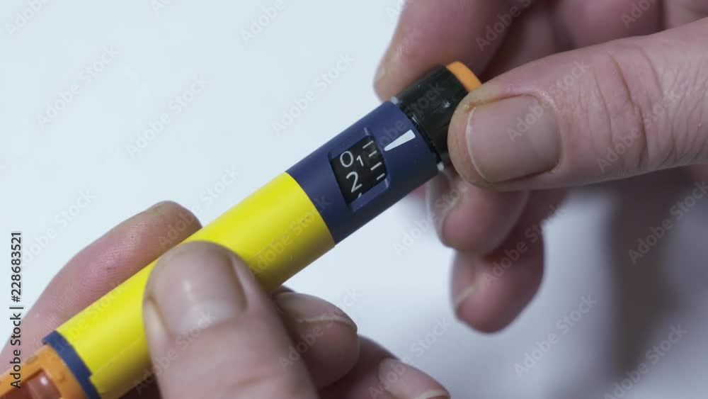 Insulin therapy routine. Patient with diabetes using diabetic insulin ...