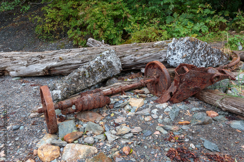 Old rusty wheels on the beach near the Treadwell mine historic park in ...