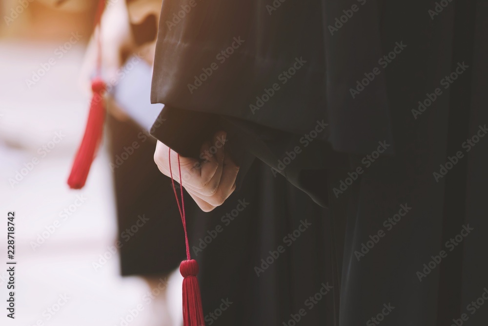 graduation,Student hold hats in hand during commencement success ...