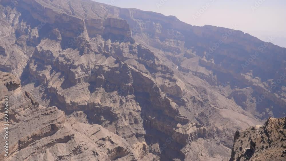 Pan over Wadi Ghul, the so-called Grand Canyon of the Sultanate of Oman ...