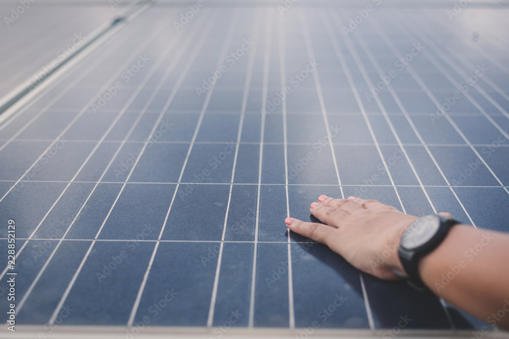 woman engineer checking heat of solar panel and using ir camera to scan ...