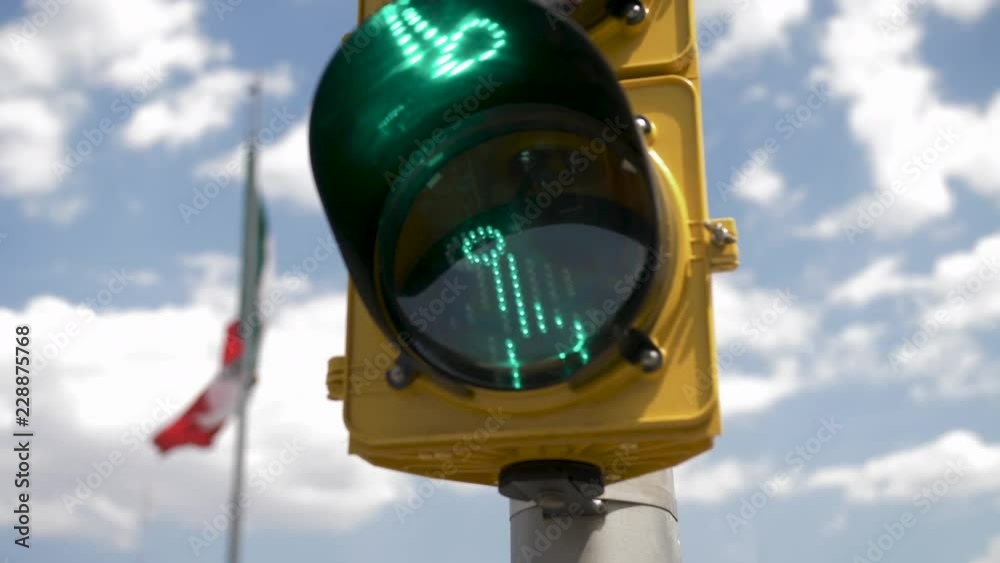 Streetlight Crosswalk Sign with Little Green Running Man in Front of ...