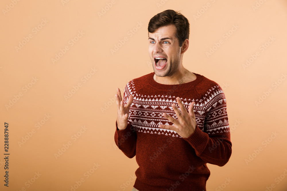 Image of caucasian man 20s with stubble wearing knitted sweater ...