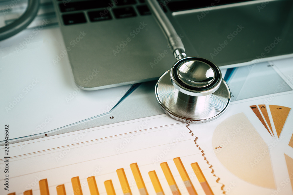 Stethoscope on computer with test results in Doctor consulting room ...