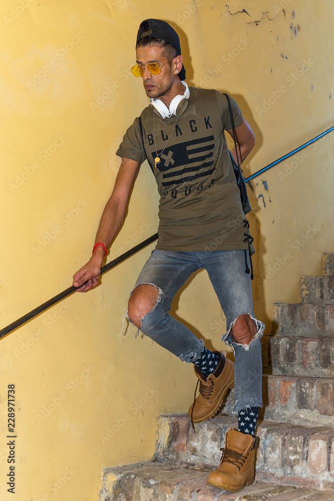 Extravagant Hipster Male Model With Sunglasses Headphones And A