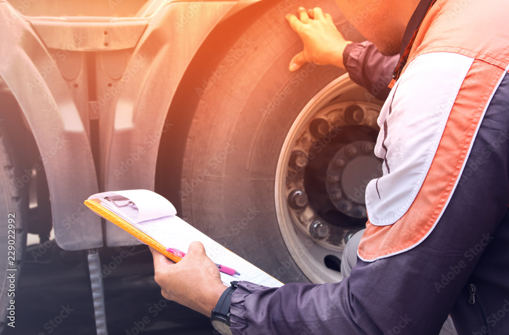 Auto Mechanic is Checking the Truck's Safety Maintenance Checklist ...