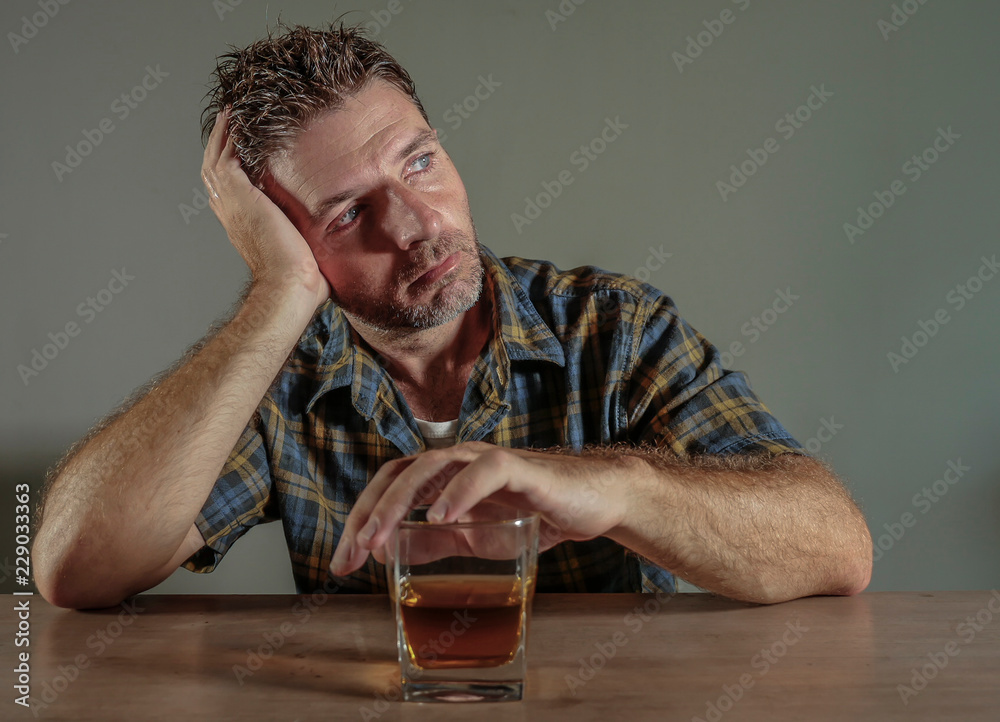 young attractive wasted and depressed addict and alcoholic man with ...