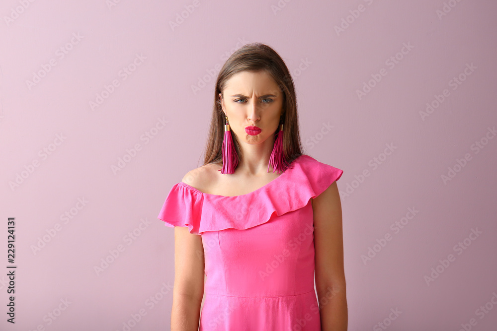Beautiful offended young woman on color background Stock Photo | Adobe ...