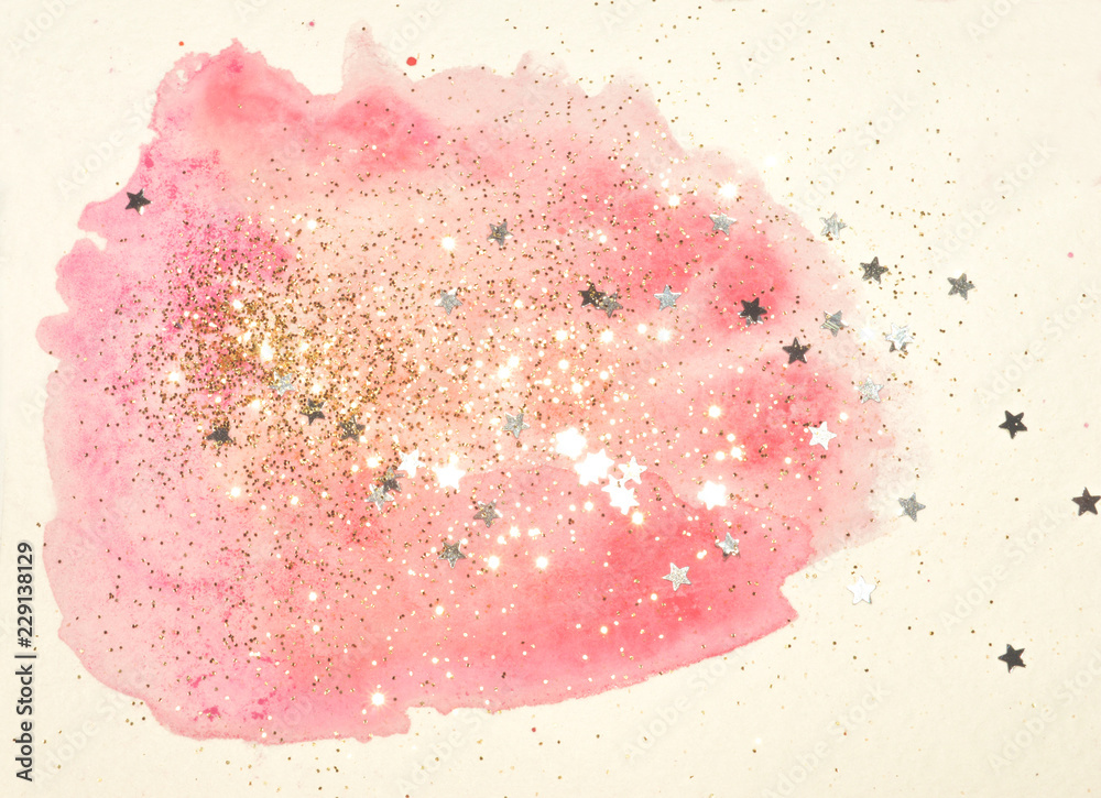 Golden glitter and glittering stars on abstract pink watercolor splash ...