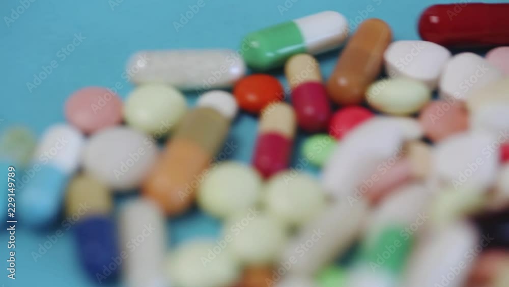 Pan view of medication drug stack with many pills Stock Video | Adobe Stock