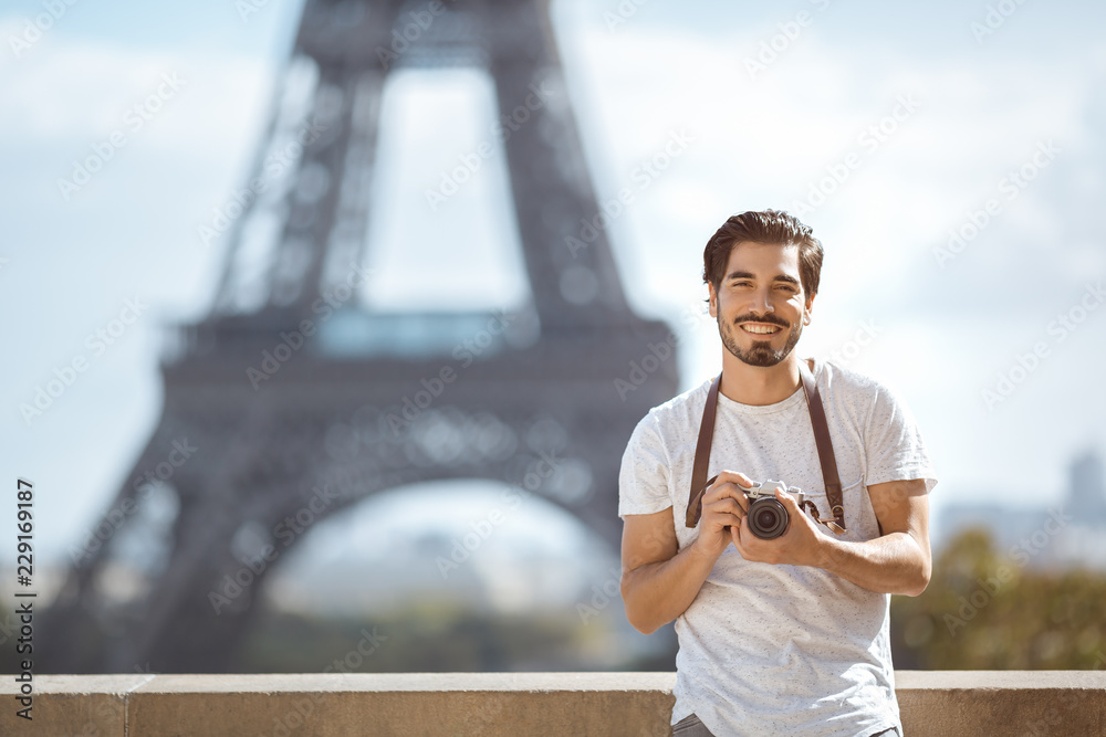 Paris Eiffel Tower tourist with camera taking pictures in front of the ...
