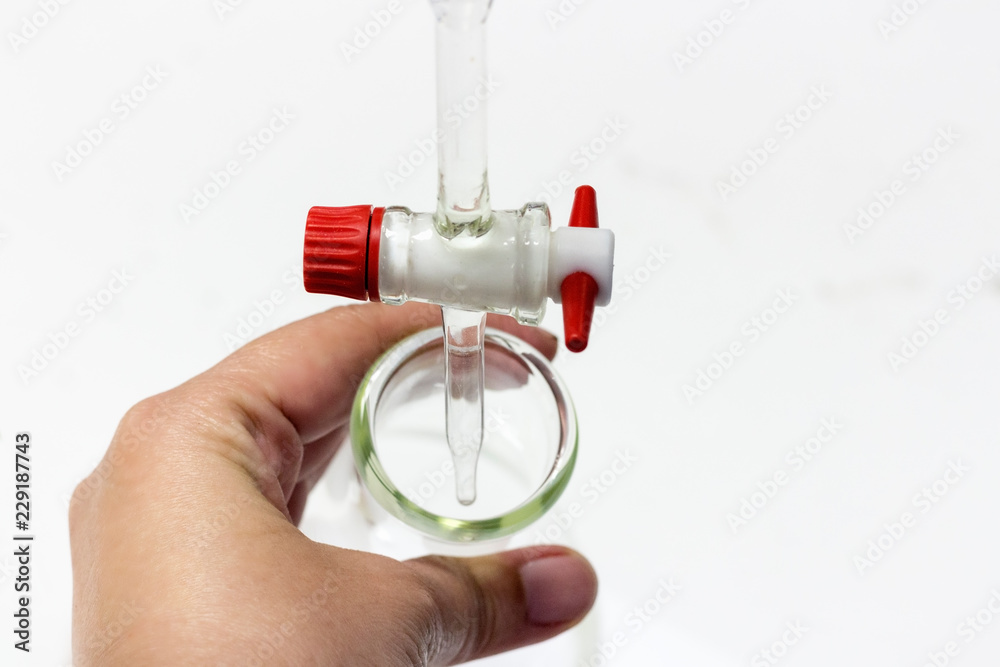 Burette and flask, Chemistry laboratory glassware with white background ...